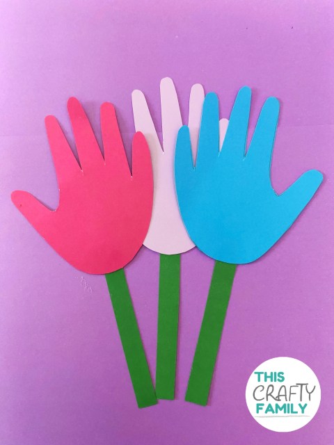 Handprint flower pot art - This Crafty Family