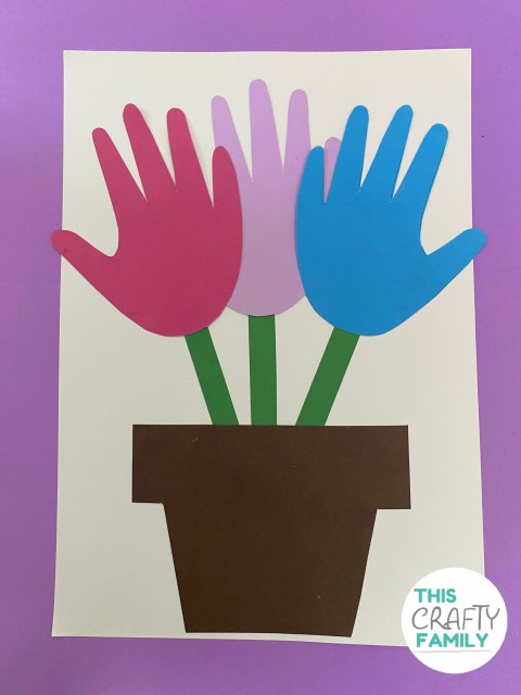 Handprint flower pot art - This Crafty Family