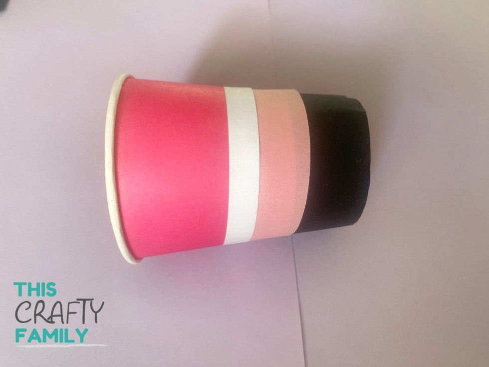 Paper cup flamingo puppet - This Crafty Family