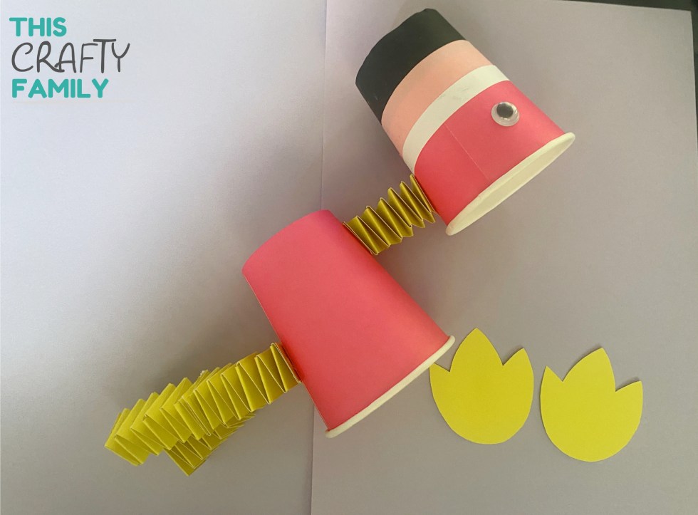 Paper cup flamingo puppet - This Crafty Family